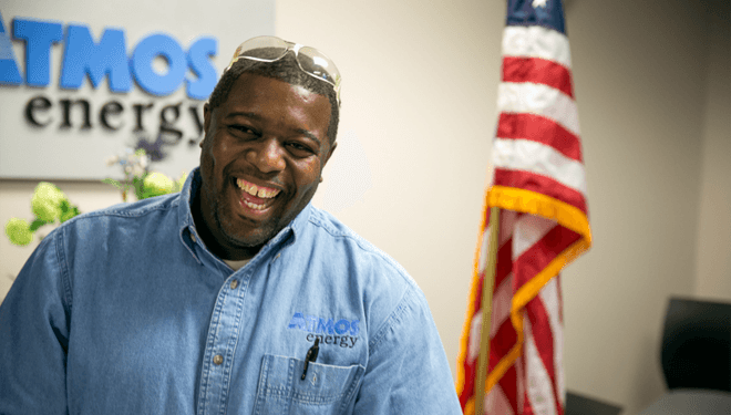 Atmos Energy employee and American flag